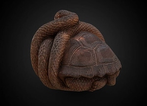 Snake curled around a turtle netsuke - Free 3d model on creazilla.com