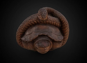 Snake curled around a turtle netsuke - Free 3d model on creazilla.com